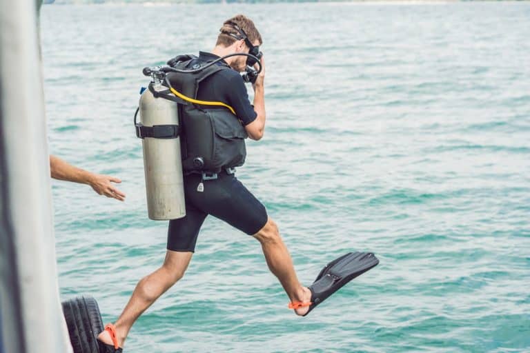 Why do Scuba Divers Dive Backwards into the Water? - Scuba Diving Gear